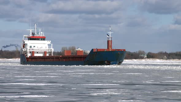 Cargo Ship Sailing Through Frozen Sea Ice in Winter, Stock Footage