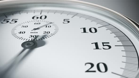 Vintage stopwatch in a timelapse. Fast forward time passing rapidly ...