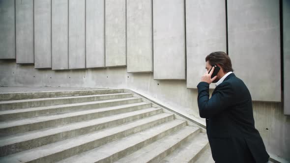 Business Man with Documents Walking Up Stairs. Male Worker Talking on ...
