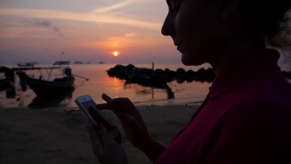 Woman Using Her Mobile Phone On The Beach Against, Stock Footage ...