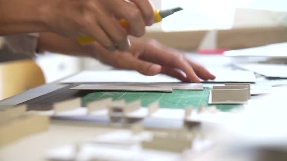 Architect Cutting Out Component For Model, Stock Footage | VideoHive