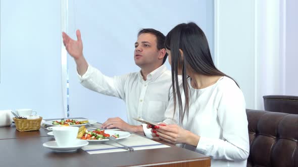 Waiter Bringing Wrong Bill To the Impatient Young Couple, Stock Footage