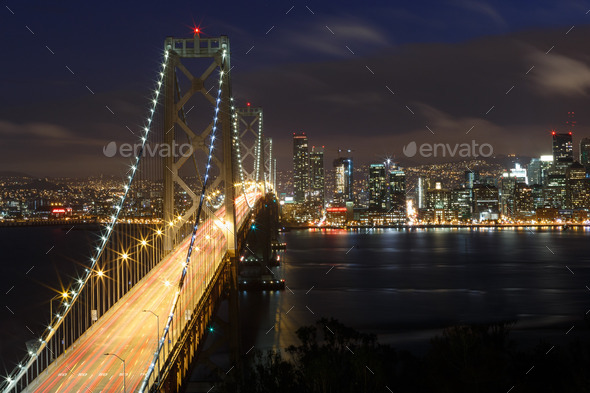San Francisco Bay Bridge and skyline at night Stock Photo by heyengel