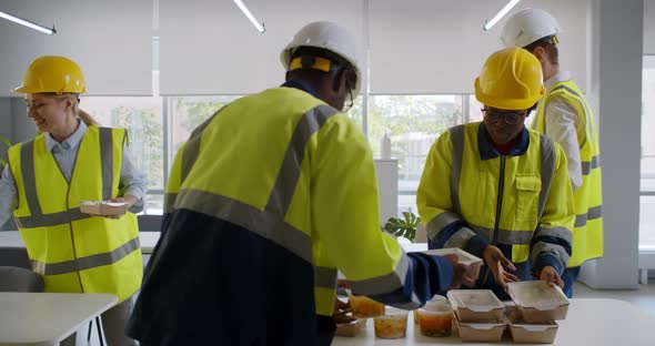 Construction Company Workers Having Takeaway Lunch in Modern Office ...