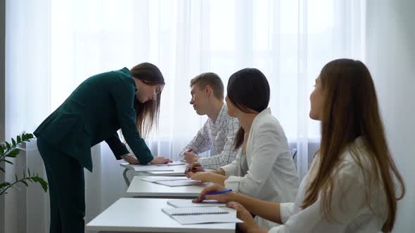 Teacher Checking Homework of Students in Class, Stock Footage | VideoHive
