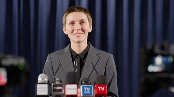 Portrait of Smiling Female Public Speaker at Press Conference, Stock ...