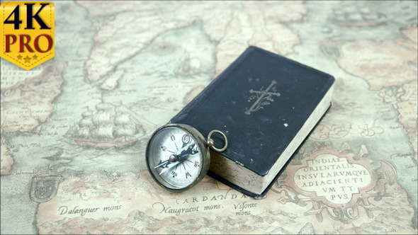 A Compass and a Book on a Map, Stock Footage | VideoHive