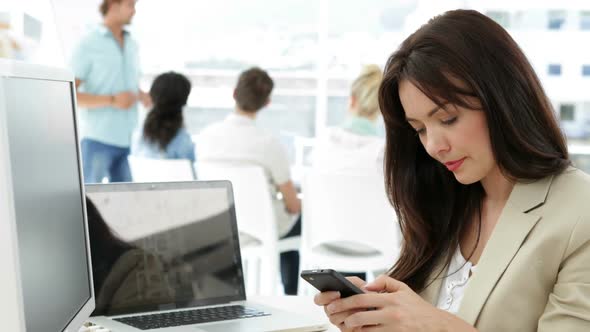 Woman Working At Her Desk Texting On The Phone, Stock Footage | VideoHive