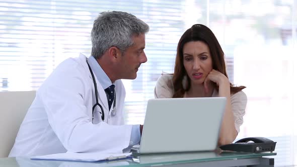Doctor Explaining A Patient Disease With A Laptop, Stock Footage ...