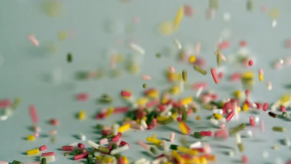 Sprinkles Pouring Onto Blue Surface, Stock Footage | VideoHive