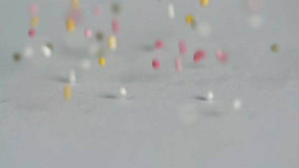 Sprinkles Pouring Onto Grey Surface, Stock Footage | VideoHive