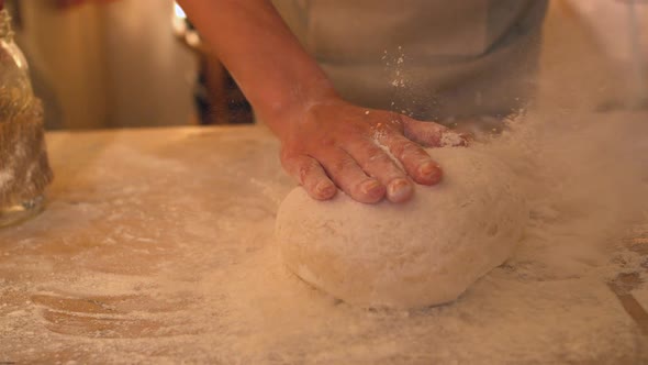 Hands Dropping Ball Of Dough Onto Floury Surface, Stock Footage | VideoHive