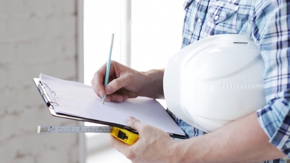 Builder With Measuring Tape Writing To Clipboard, Stock Footage | VideoHive