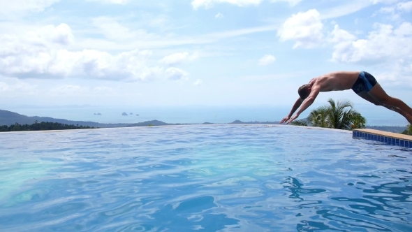 Man Jumping And Diving In Infinite Pool Outdoor, Stock Footage | VideoHive