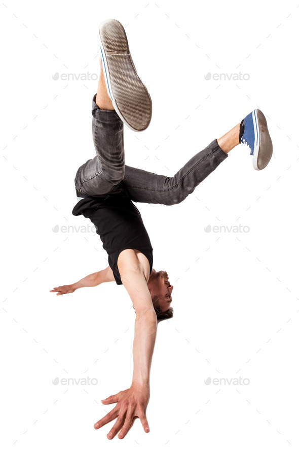 Break dancer doing one handed handstand against a white background ...