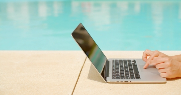 Working On Laptop In Swimming Pool Area, Stock Footage | VideoHive