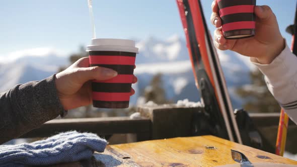 Couple of Skiers Drinking Mulled Wine on the Mountain at Lunch Time ...
