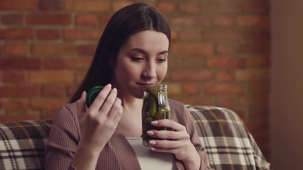 Close Up Portrait of Young Pregnant Woman Enjoying Pickles Smell ...