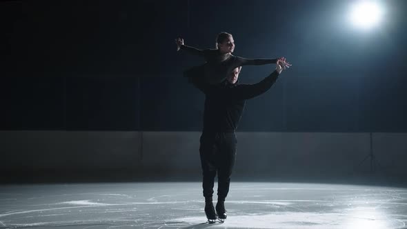 Figure Skating Lift on Ice Rink Sporty Pair is Performing Element of ...