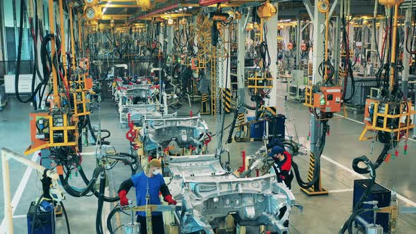 Mechanics Are Assembling Cars in Fast Motion, Stock Footage | VideoHive