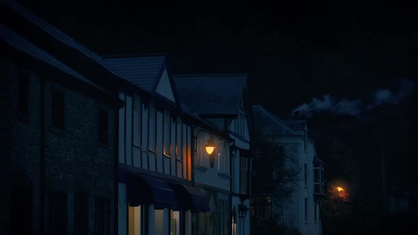 Village Storefronts In The Evening With Smoking Chimney, Stock Footage
