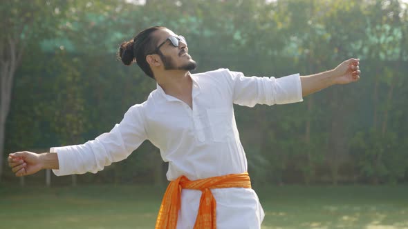 Happy Indian man dancing in an Indian traditional outfit Kurta Pajama ...