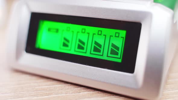 Screen with Animation of Charging Rechargeable Batteries on a Green ...