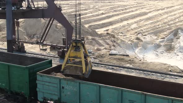 Loading Sand Into Rail Cars with the Help of a Career Excavator, Stock ...