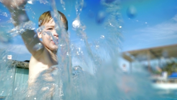 Happy Child In Swimming Pool Splashing Water, Stock Footage | VideoHive