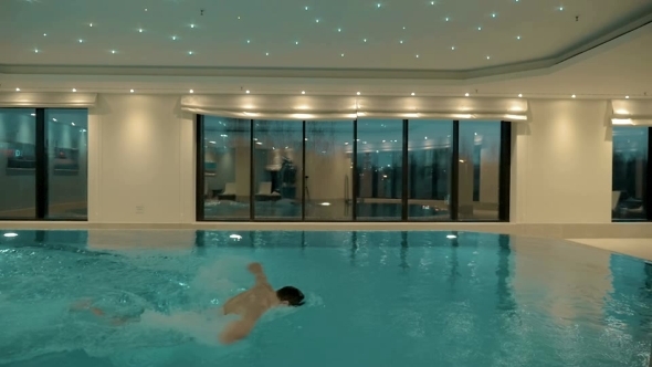 Man Swimming Alone In The Indoor Pool, Stock Footage | VideoHive