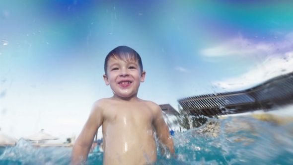 Boy Having Fun In The Pool On Resort, Stock Footage | VideoHive