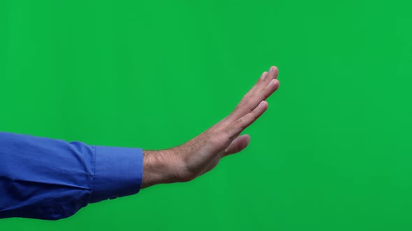 Close Up of Male Hand in Stop Position on Isolated Green Background ...