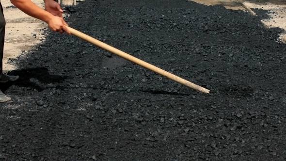 Manual Labor On The Distribution Of Asphalt On The, Stock Footage ...