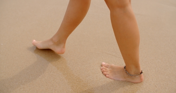 Close Up Of Woman Walking On Sandy Beach, Stock Footage | VideoHive