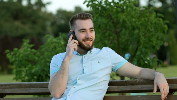 Smiling Handsome Man Talking On The Phone In Park, Stock Footage ...