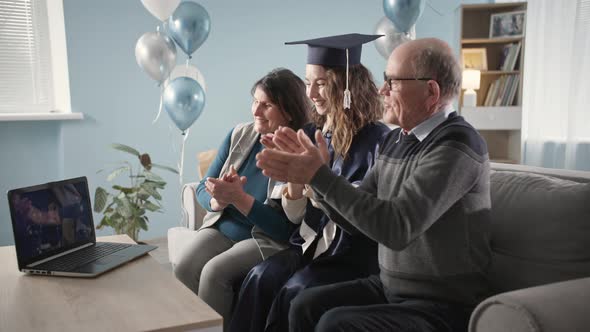 Happy University Graduate with Parents Happily Clapping Their Hands ...