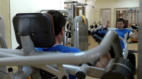 Man Having Workout On Modern Exercise Machine, Stock Footage | VideoHive