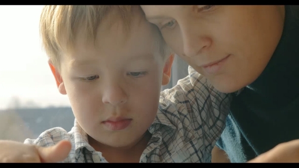 They Have Fun Playing Together On Touch Pad In, Stock Footage | VideoHive