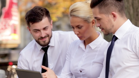 Three Colleagues Analyzing Some Project, Stock Footage | VideoHive
