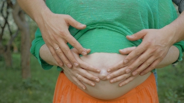Parent's Hands On Belly With Unborn Child, Stock Footage | VideoHive