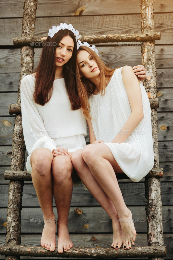 Two beautiful girl Stock Photo by simbiothy | PhotoDune