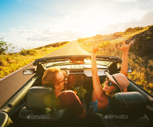 Happy Couple Driving in Convertible Stock Photo by EpicStockMedia ...