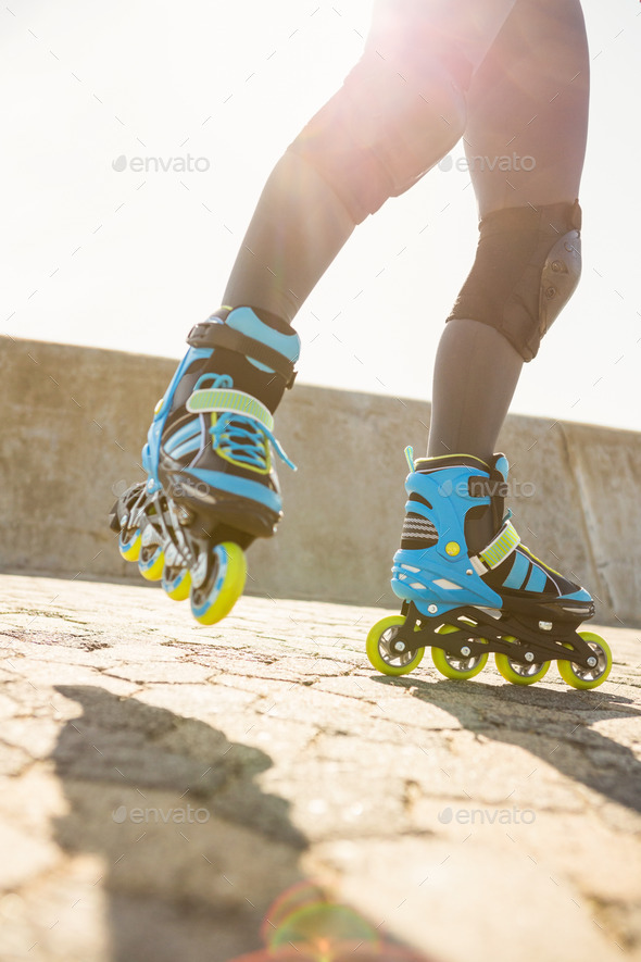 Close up view of inline skates skating at promenade Stock Photo by ...