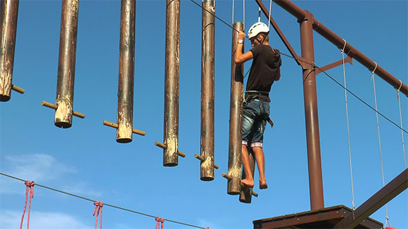Man Goes on Beam that are Hanging on the Ropes, Stock Footage | VideoHive