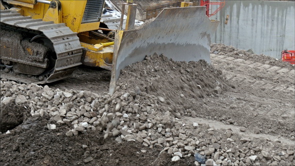 A Bulldozer Pushing Some Stones on the Road, Stock Footage | VideoHive