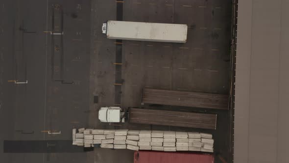 Top Down Overhead Aerial View of Trailers Trucks and Containers Parked ...