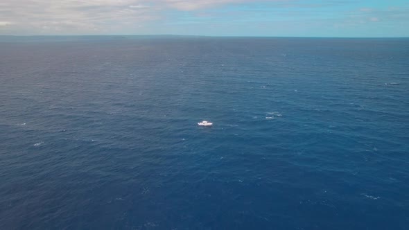 Isolated Boat in Open Sea, Pull Back Aerial View With Stunning Endless ...