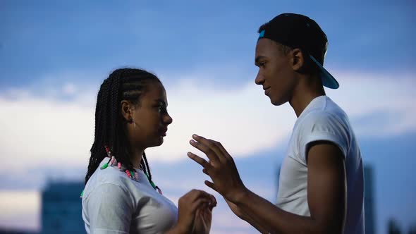 Teenage Couple Putting Foreheads Together, Holding Hands, Full Trust ...