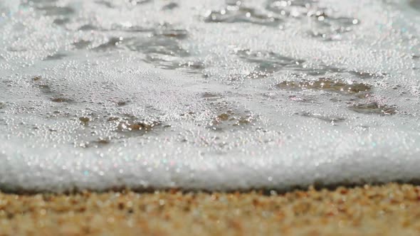 Closeup Slow Motion Footage of Beach of Gravel the Coarse Sand Waves ...