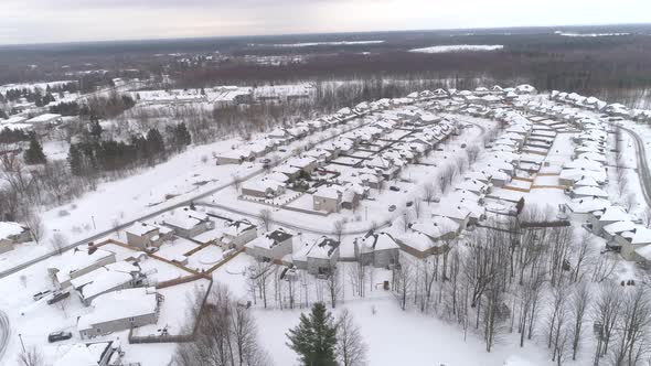 neighbourhood winter aerial of snowy community, Stock Footage | VideoHive